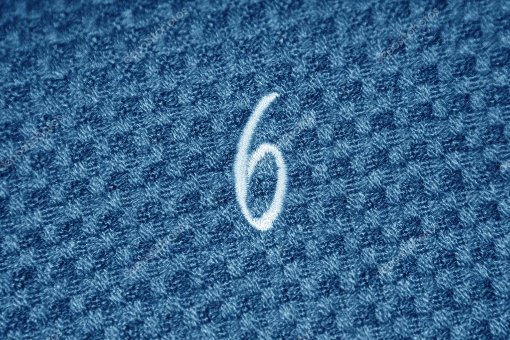 Embroidered number on cloth — Stock Photo © lnzyx #80917554
