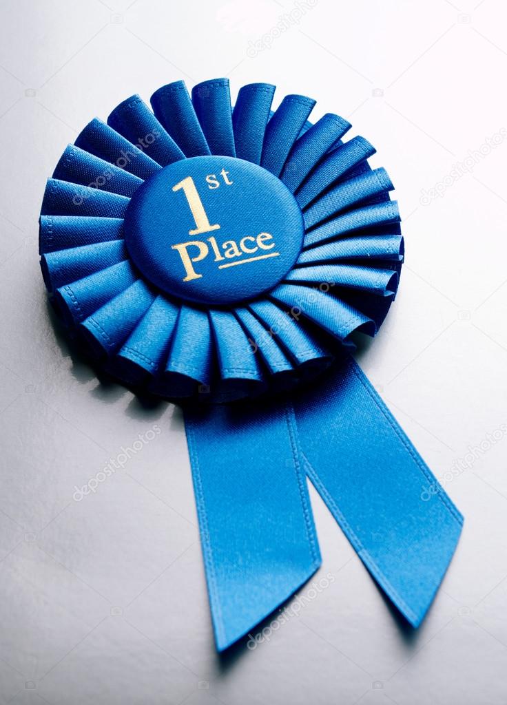 Blue first place winner rosette Stock Photo by ©serggn 53322817