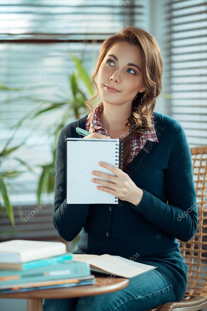 Dreamy girl writing — Stock Photo © mike_laptev #60763143