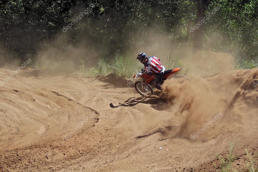 MX biker at turn of in sandy ruts — Stock Photo © 63vvksam #91409526