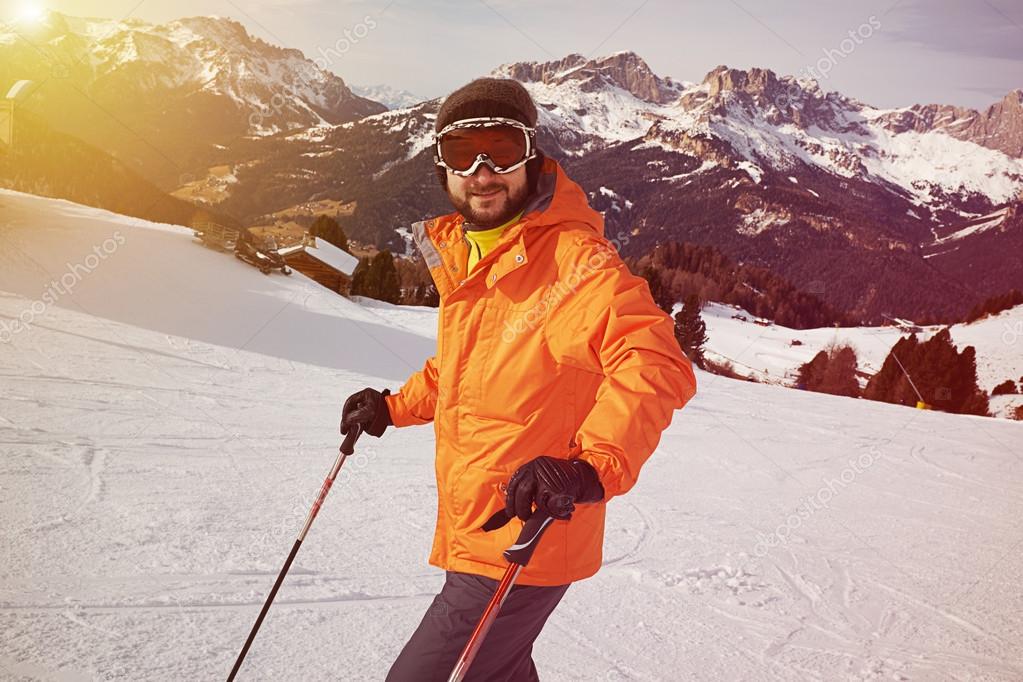 Smiley skier in orange jacket — Stock Photo © konstantynov #101857896