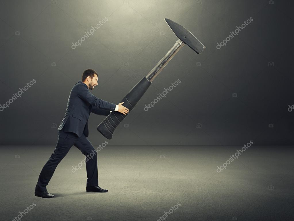 Man holding hammer Stock Photo by ©konstantynov 56554433