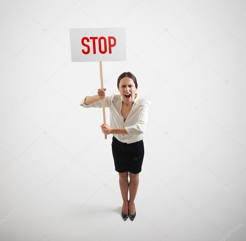 Woman holding placard with stop sign Stock Photo by ©konstantynov 71908733