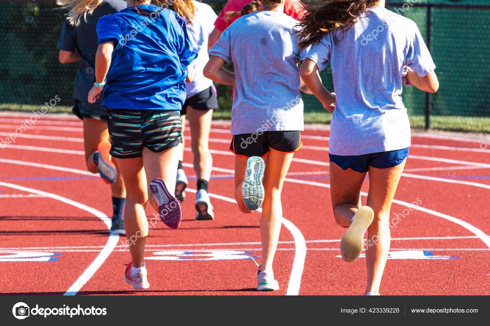 2 Girls Running Track