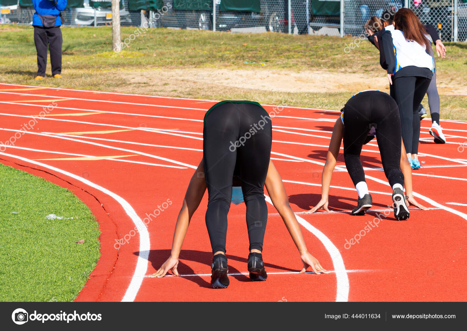 Rear View Female Sprinter Runners Set Position Outdoor Track High ...