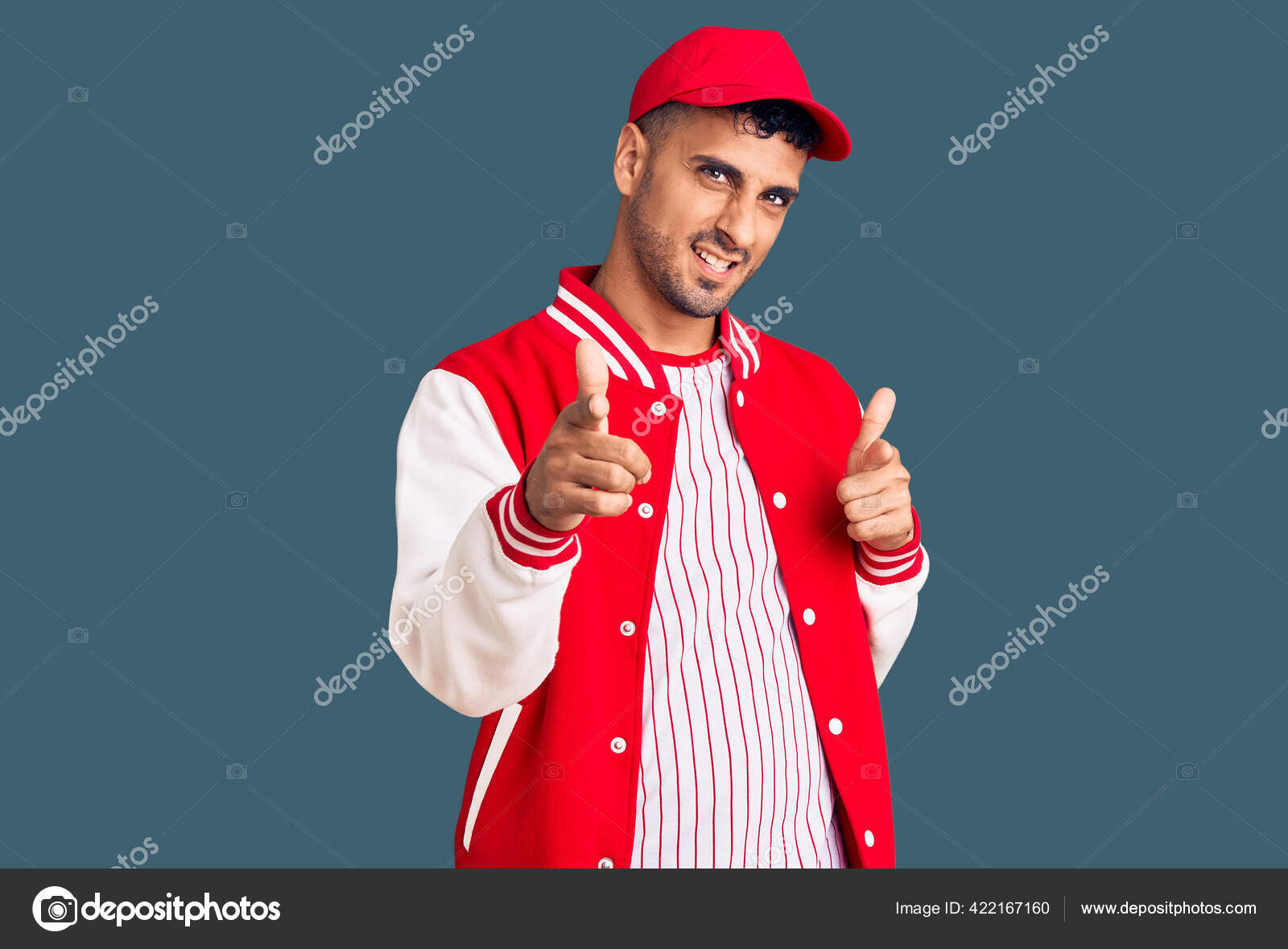 Young Hispanic Man Wearing Baseball Uniform Pointing Fingers Camera ...