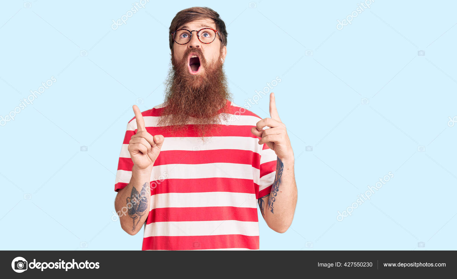 Handsome Young Red Head Man Long Beard Wearing Casual Clothes Stock