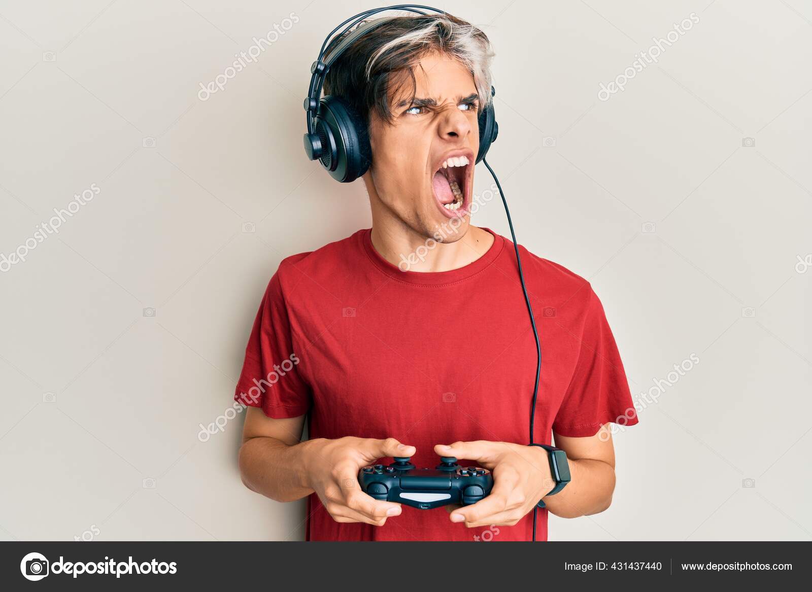 Young Hispanic Man Playing Video Game Holding Controller Angry Mad ...