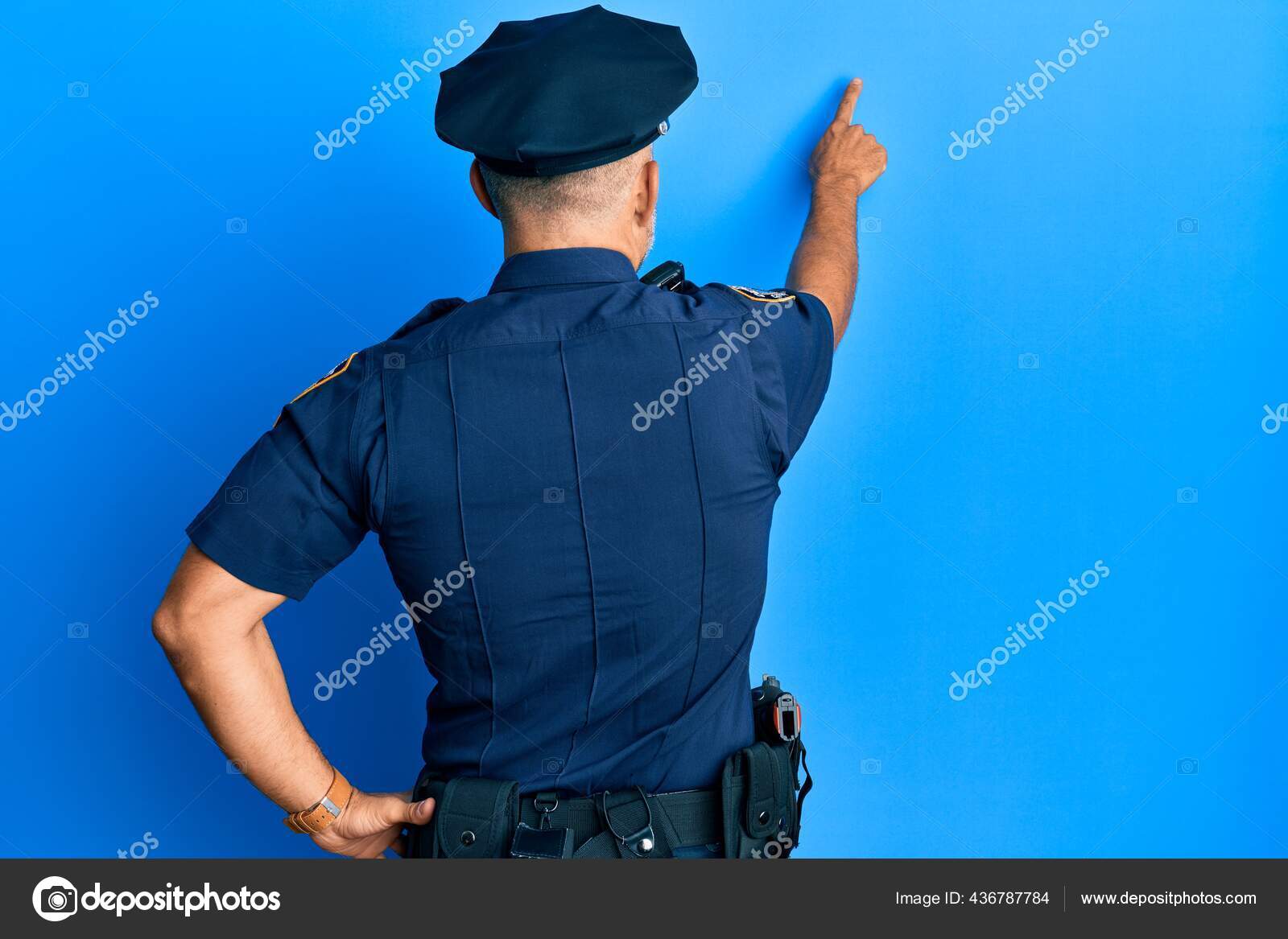 Middle Age Handsome Man Wearing Police Uniform Posing Backwards ...