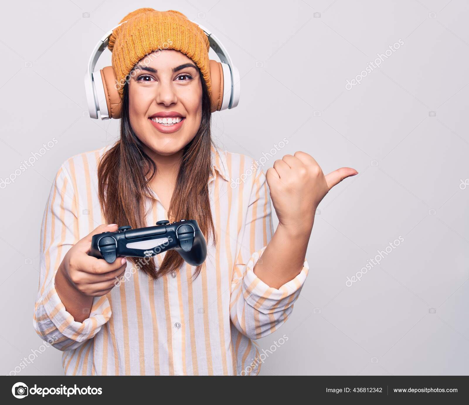 Young Beautiful Brunette Gamer Woman Playing Video Game Using Joystick ...