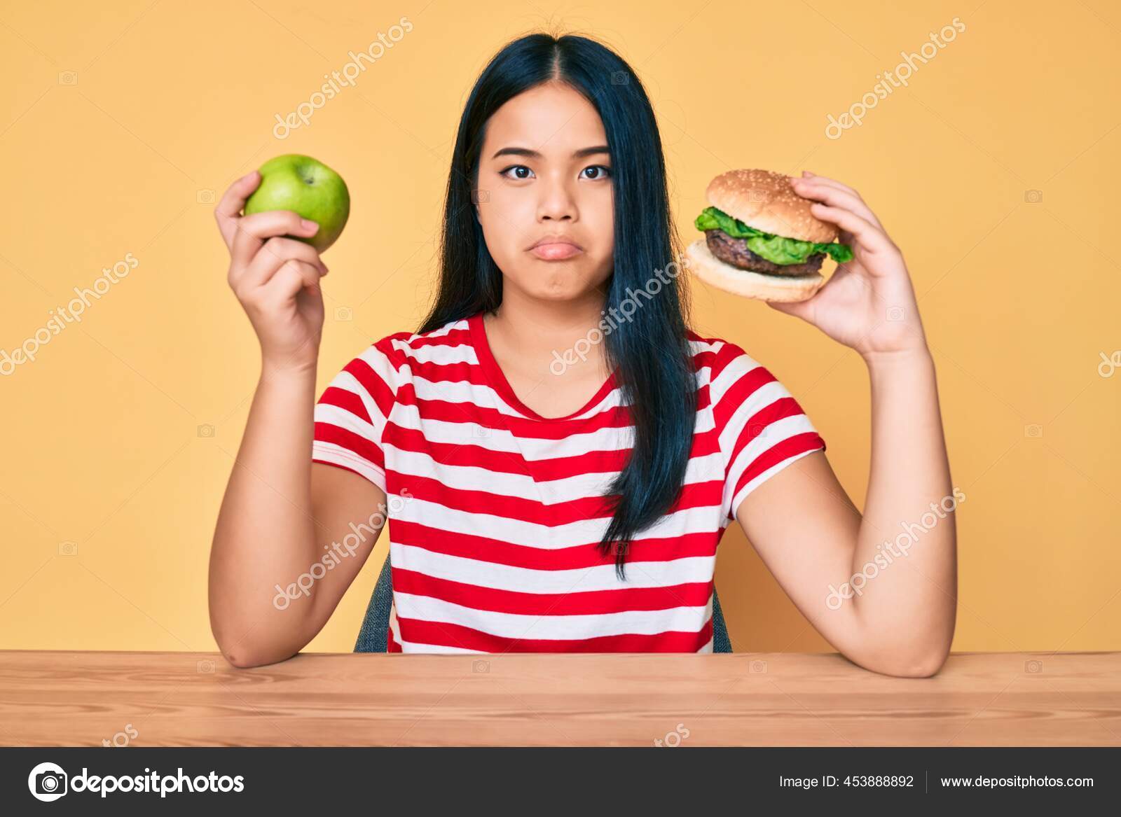 Young Asian Girl Comparing Burger Healthy Apple Depressed Worry ...