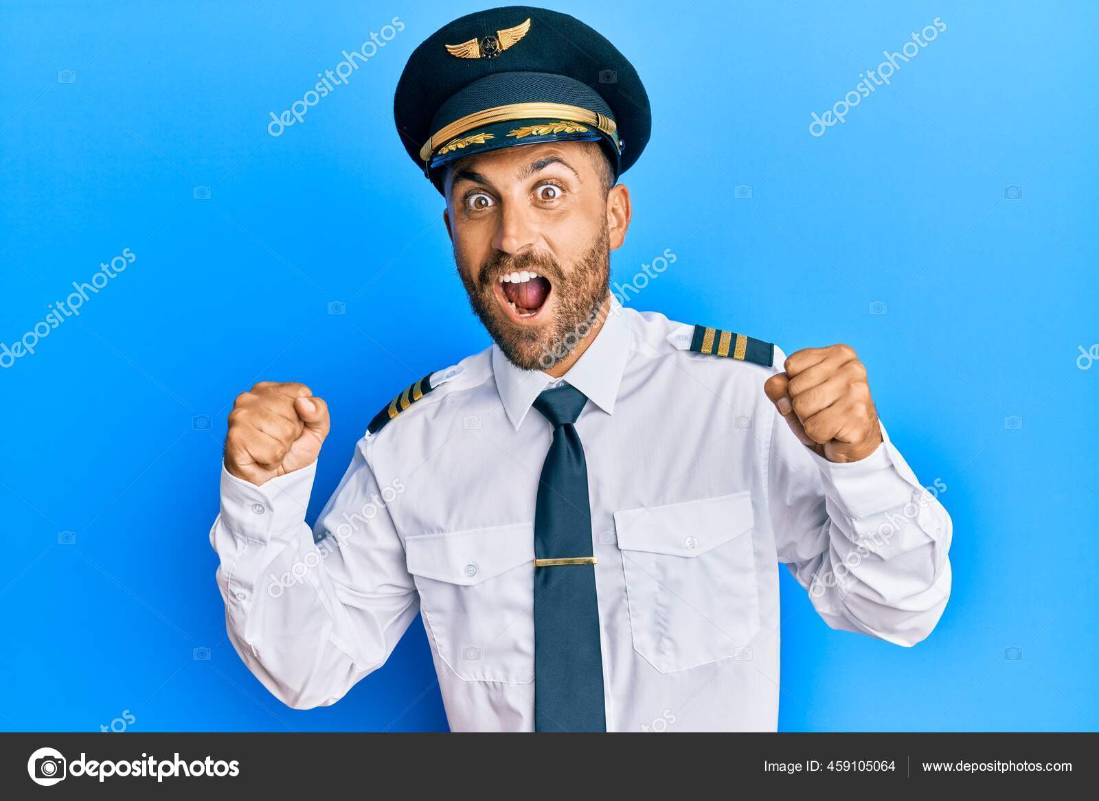 Handsome Man Beard Wearing Airplane Pilot Uniform Celebrating Surprised