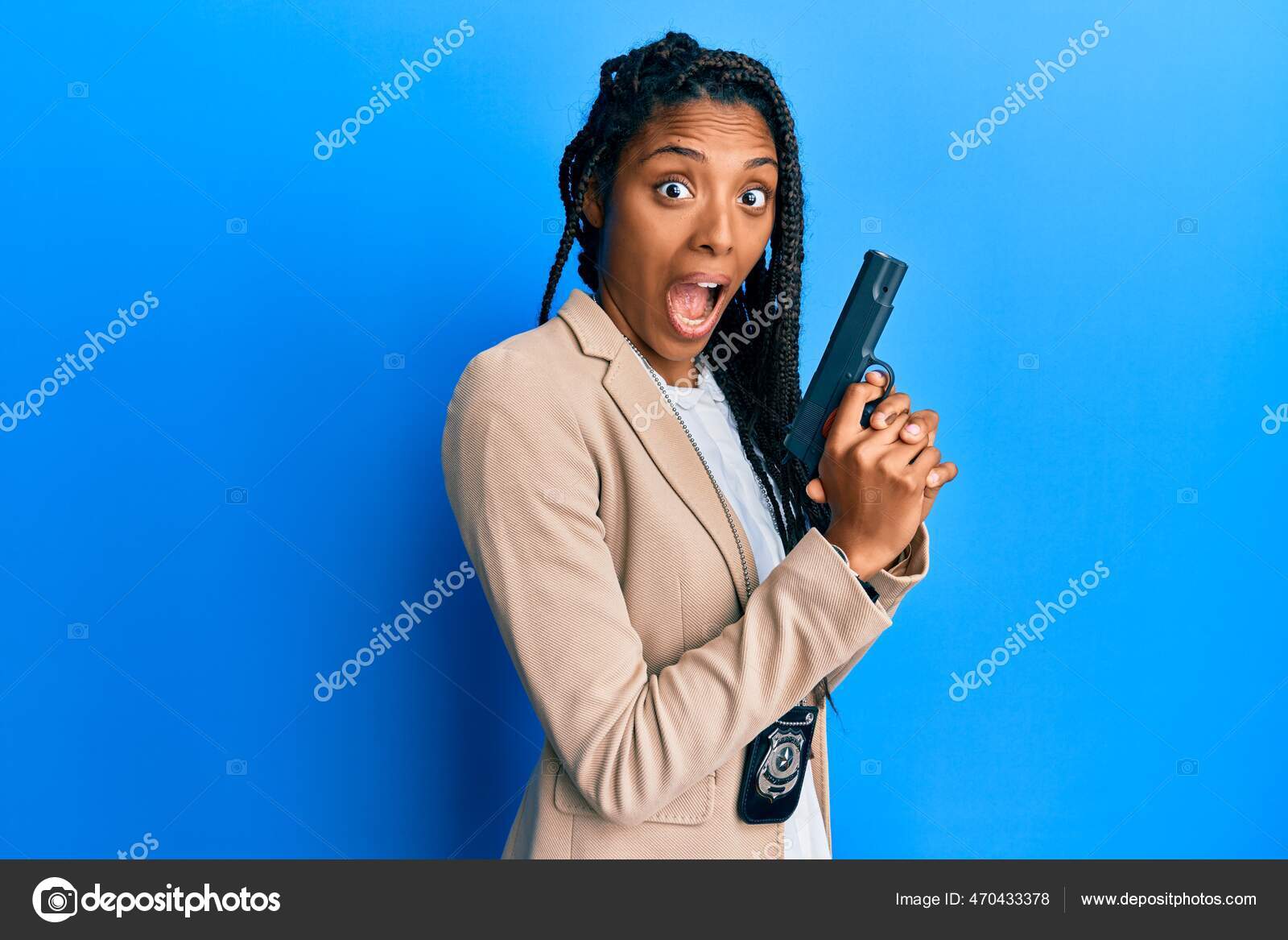African American Police Woman Holding Gun Celebrating Crazy Amazed
