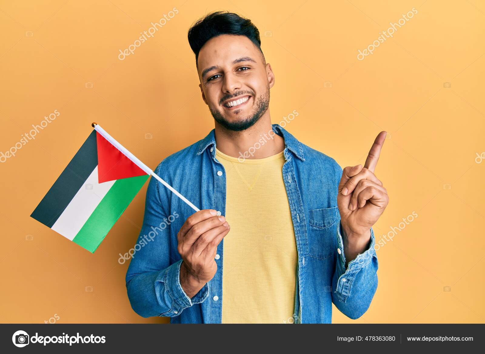 Young Arab Man Holding Palestine Flag Smiling Happy Pointing Hand ...