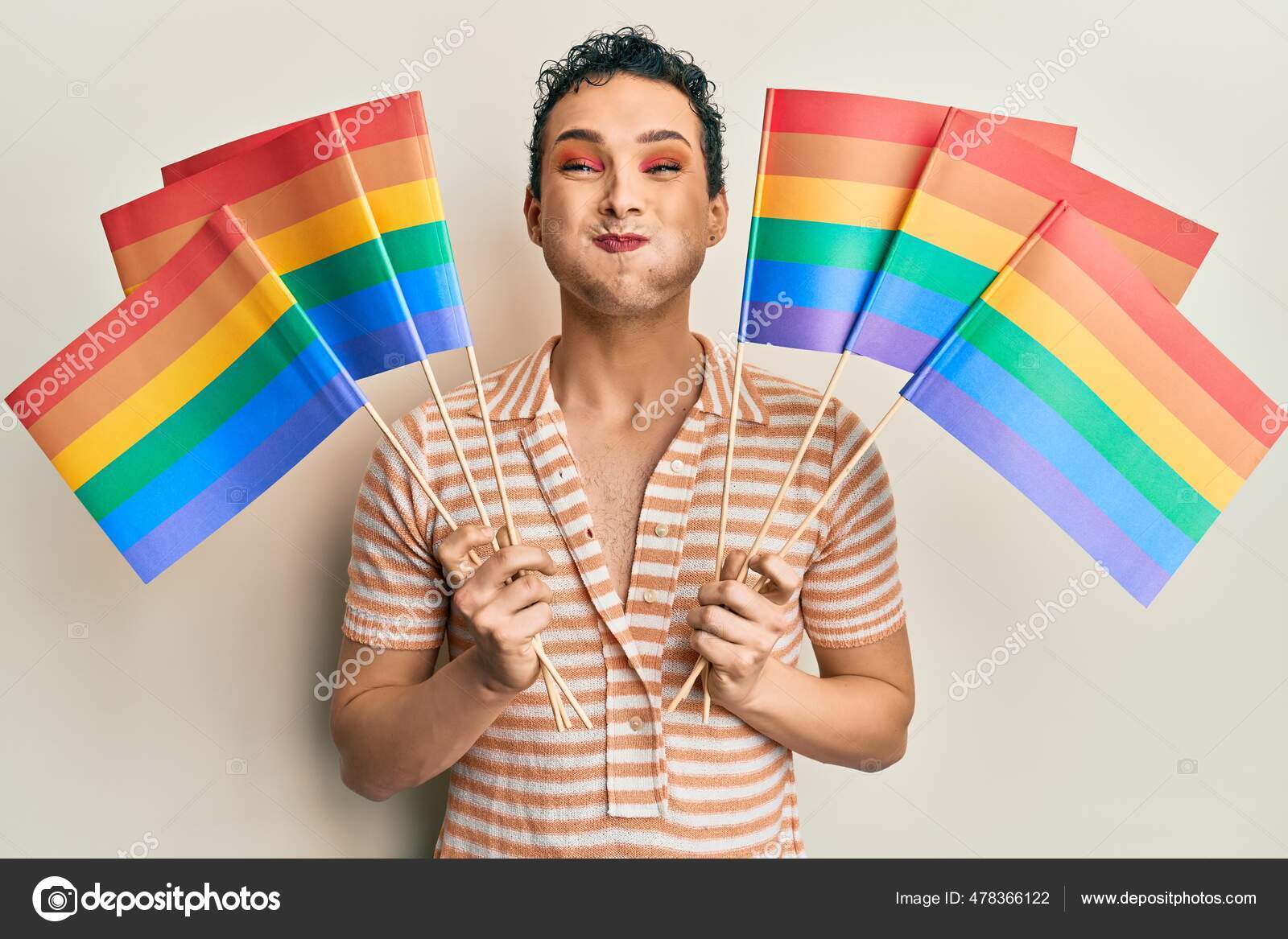 Handsome Man Wearing Make Holding Rainbow Lgbtq Flags Puffing Cheeks ...