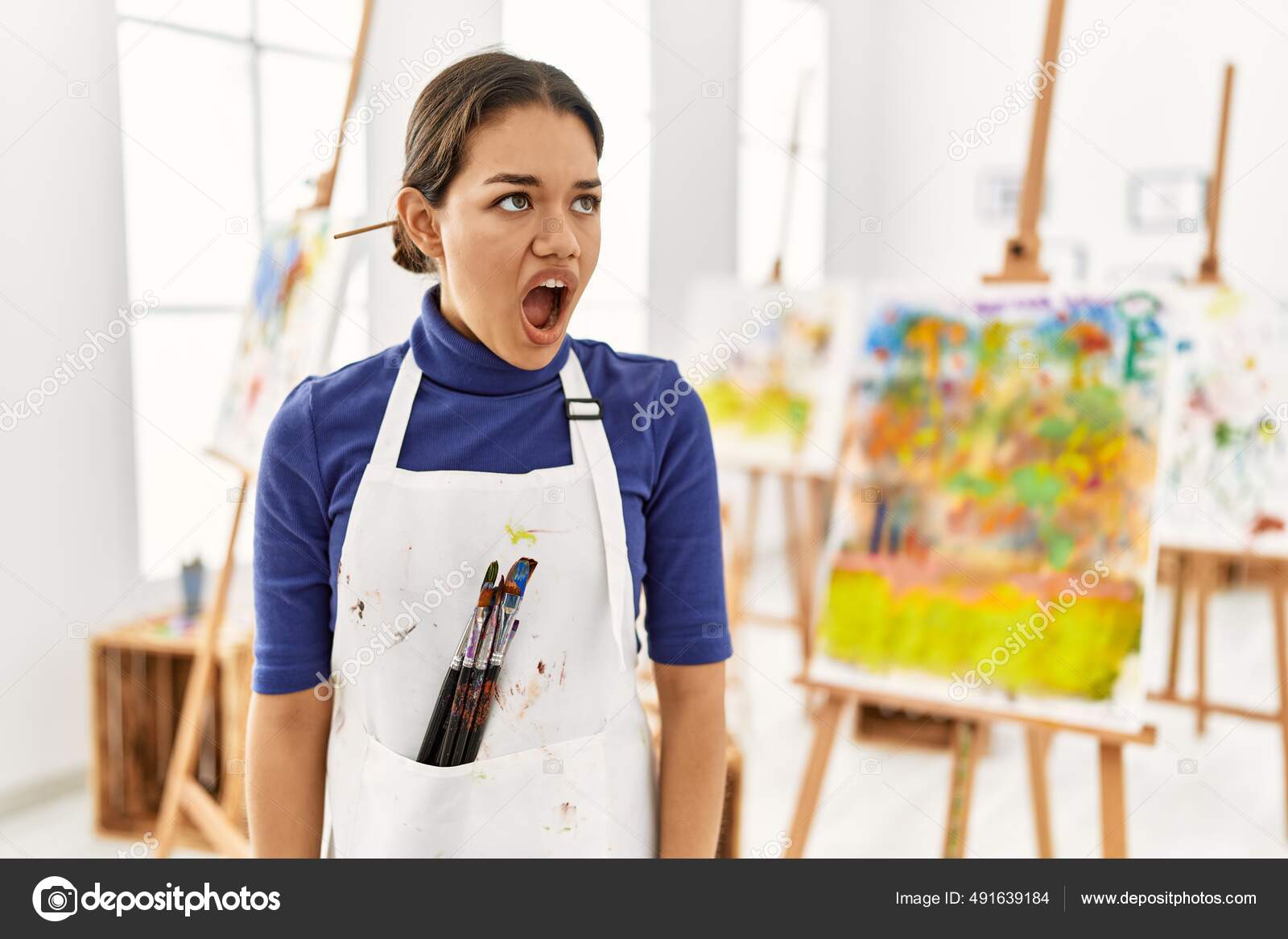 Young Brunette Woman Art Studio Angry Mad Screaming Frustrated Furious ...