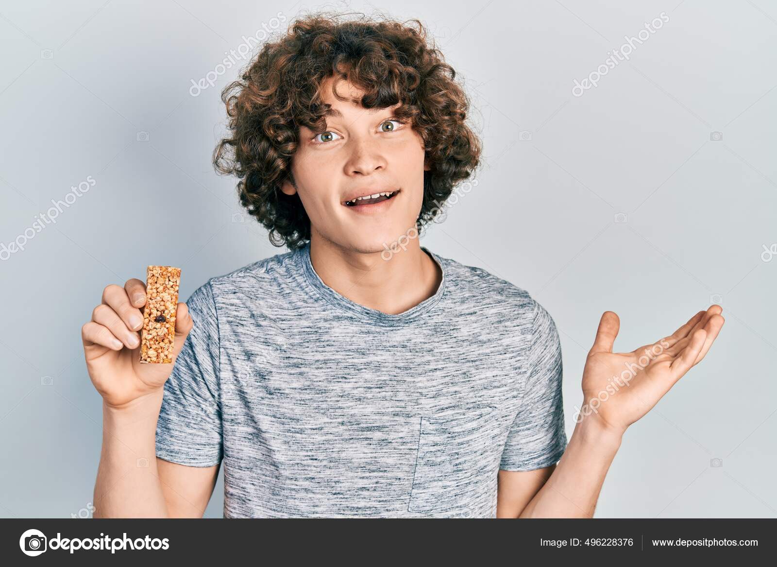 Handsome Young Man Eating Protein Bar Healthy Energy Snack Celebrating ...