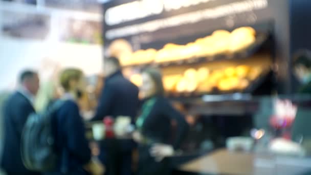 Blurred silhouettes of unrecognizable business people at a business ...