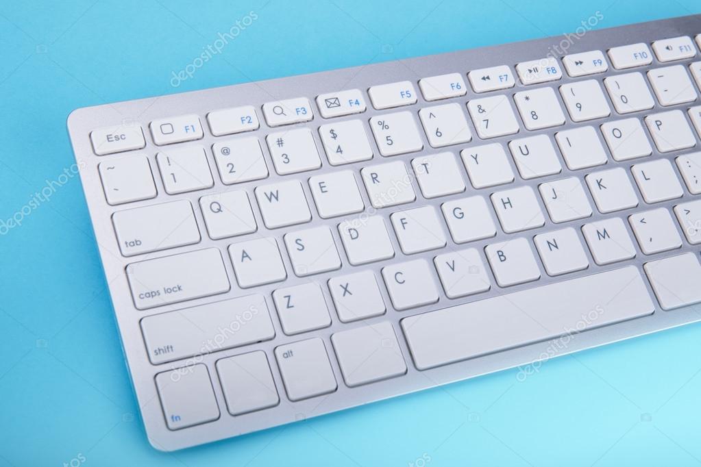 Computer keyboard on blue background — Stock Photo © SectoR_2010 #119320678
