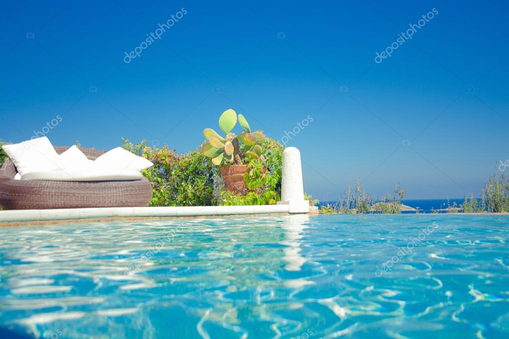 Luxury infinity swimming pool with sea view — Stock Photo © SectoR_2010 #83883124