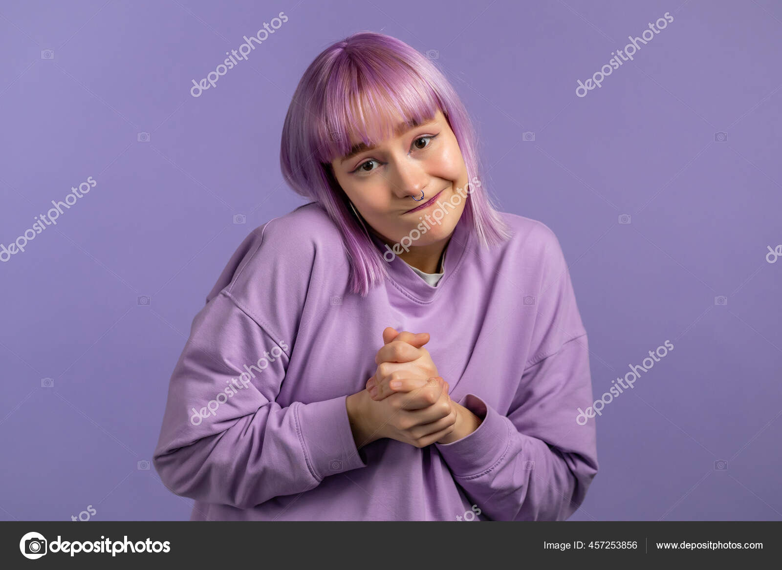 Guilty confused woman making oops, im sorry expression. Girl with dyed ...