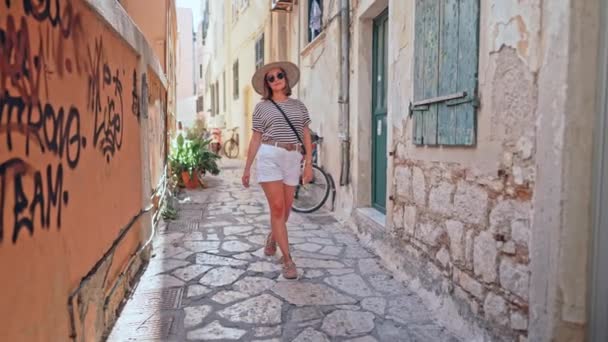Corfu, Greece - September, 2021. Woman walking alone, exploring old ...