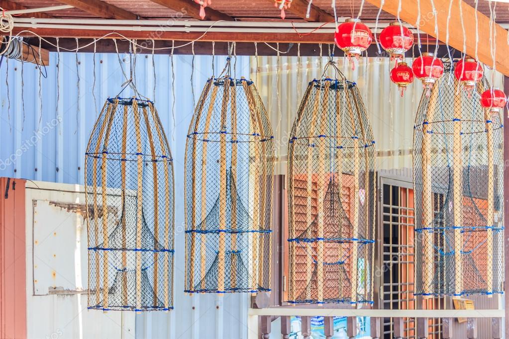 Fish traps hanging outisde a house — Stock Photo © SvetlanaSF #72981079