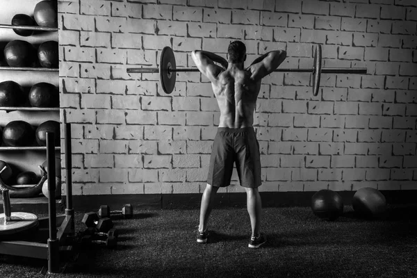 Barbell weight lifting man rear view workout gym - Stock Image - Everypixel