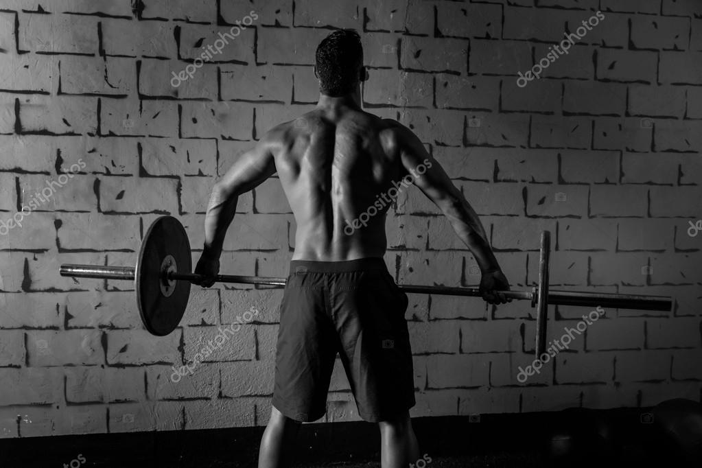 Barbell weight lifting man rear view workout gym — Stock Photo ...