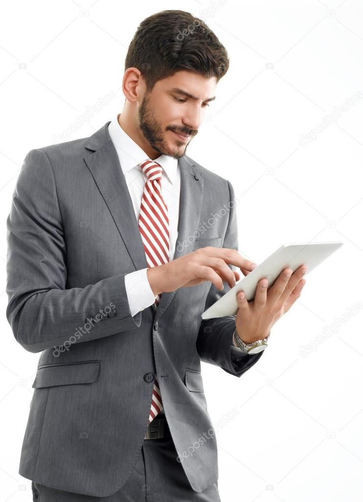 Sales man holding digital tablet Stock Photo by ©gzorgz 81808196