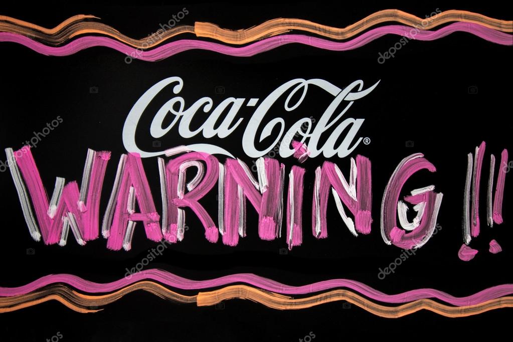 Coca-Cola brand logo and the word warning — Stock Editorial Photo ...
