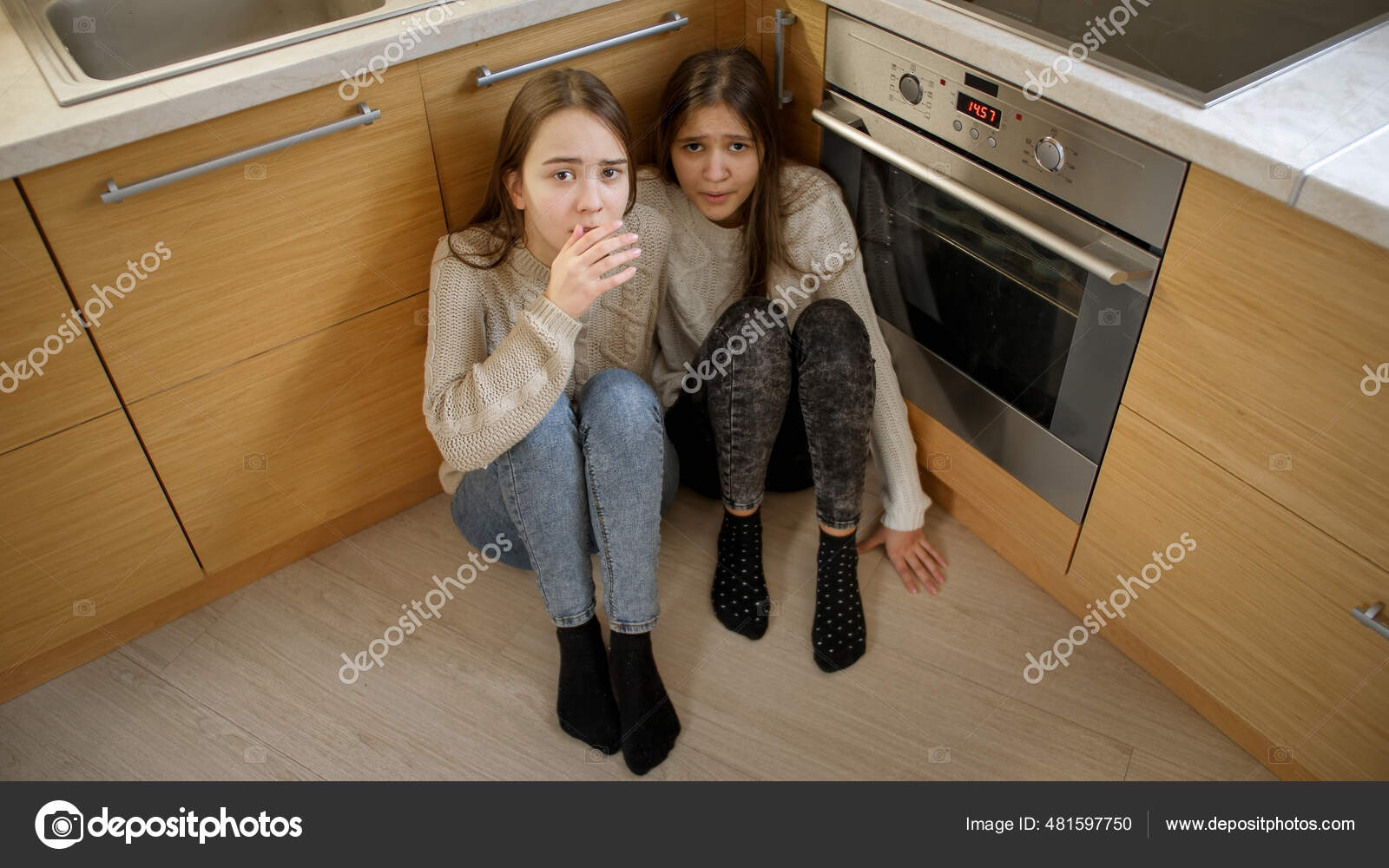 Two girls hiding from aggression or anger of parent. Concept of ...