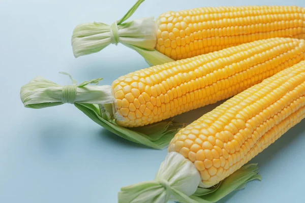 Fresh Corn Cobs Color Background Stock Photo by ©serezniy 427494828