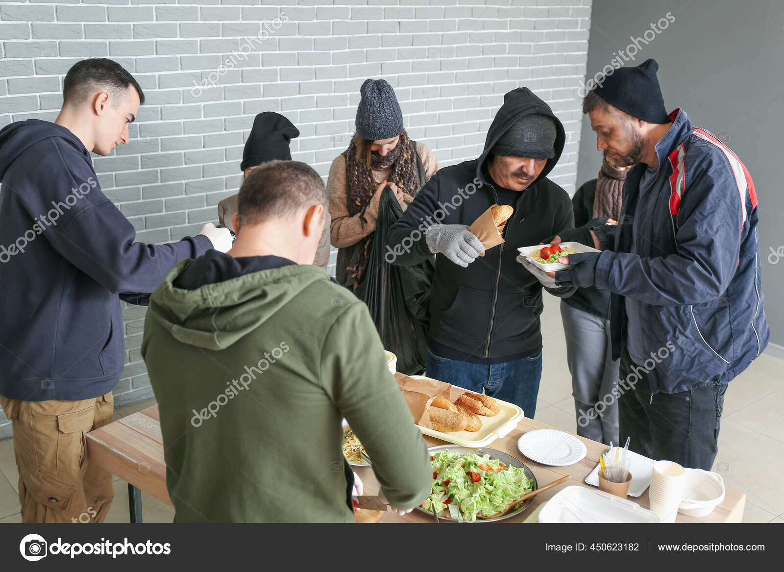 People Giving Food To The Homeless