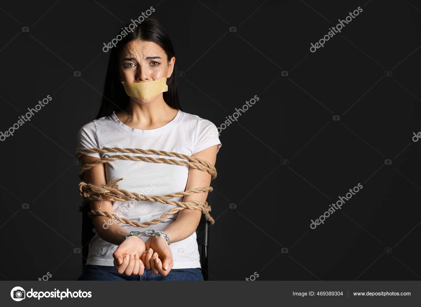Female Hostage Dark Background Stock Photo by ©serezniy 469389304