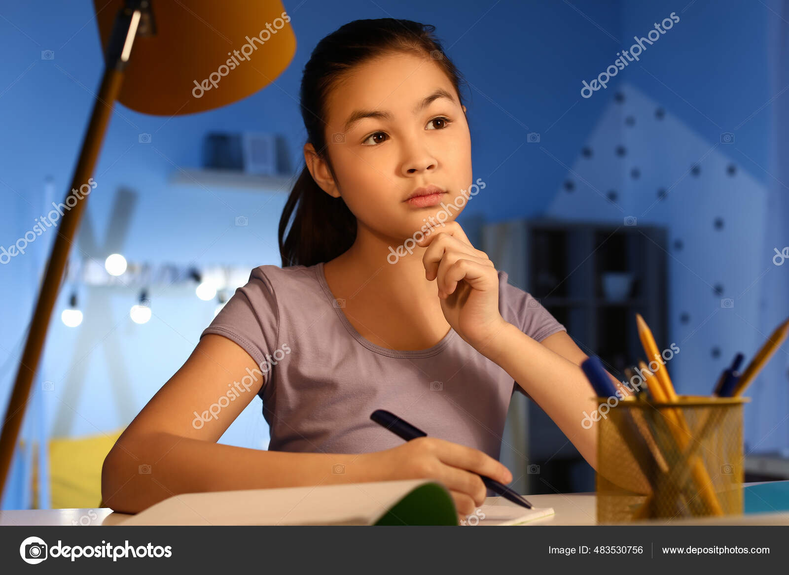 Thoughtful Little Girl Doing Homework Home Late Evening Stock Photo by ...