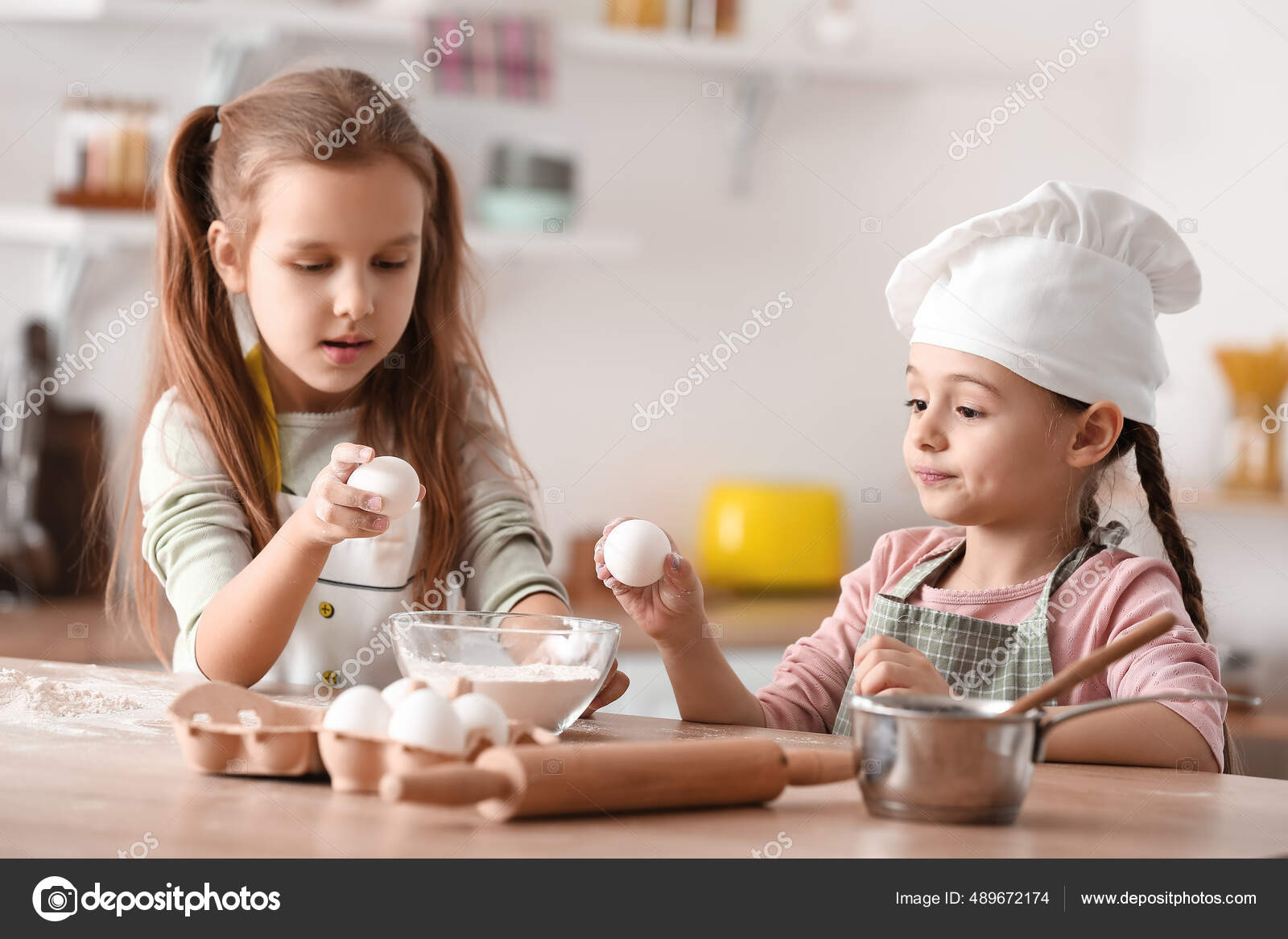 Cute Little Sisters Cooking Kitchen — Stock Photo © serezniy #489672174