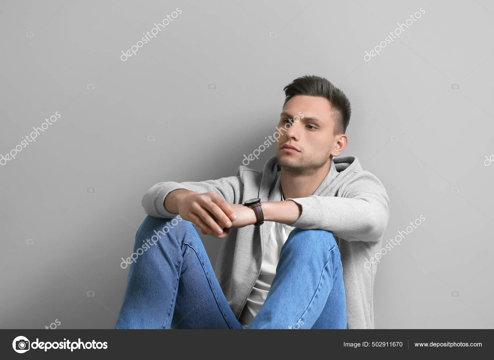 Depressed Young Man Grey Background Stock Photo by ©serezniy 502911670