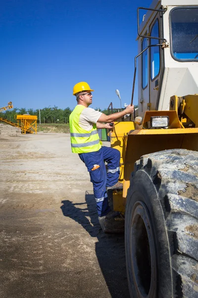 man standing on bucket wheel excavator — Stock Photo © DuxX73 #128330688