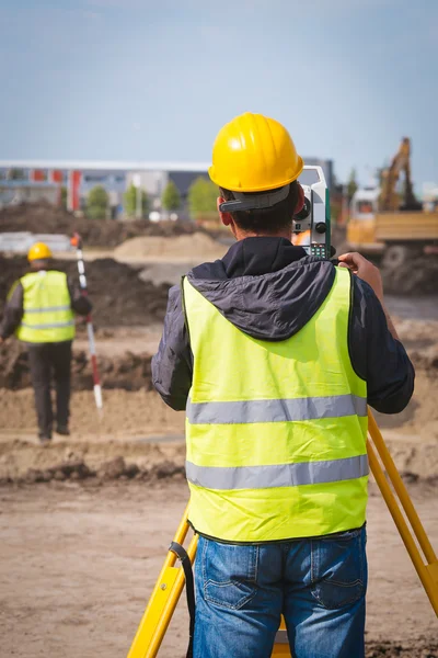 Surveyor engineer worker making measuring with theodolite tool ...