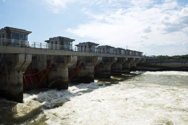 Reset of water at hydroelectric power station on the river Stock Photo ...