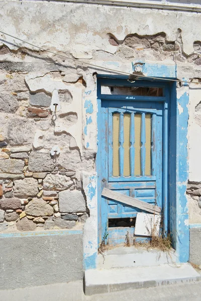 Old rotten house with a wooden green door Stock Photo by ©kama71 75472375