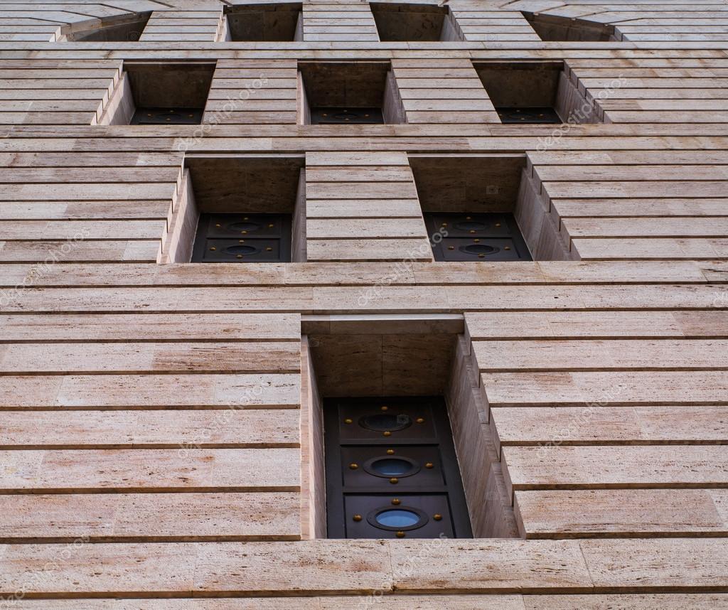 Deep narrow windows in stone wall Stock Photo by ©Trimitrius 117341432