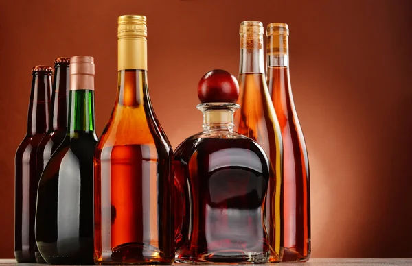 Bottles and glasses of assorted alcoholic beverages — Stock Photo ...