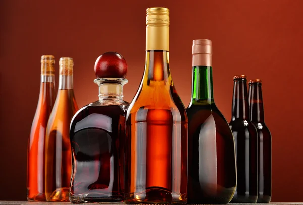 Bottles and glasses of assorted alcoholic beverages — Stock Photo ...