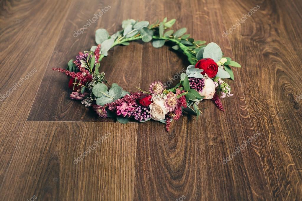 Beautiful wedding red rose flower crown on wooden background Stock ...