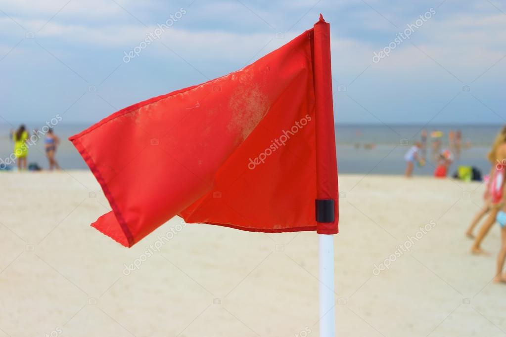 Red flag on the beach of the Baltic Sea — Stock Photo © Victor_DVA ...