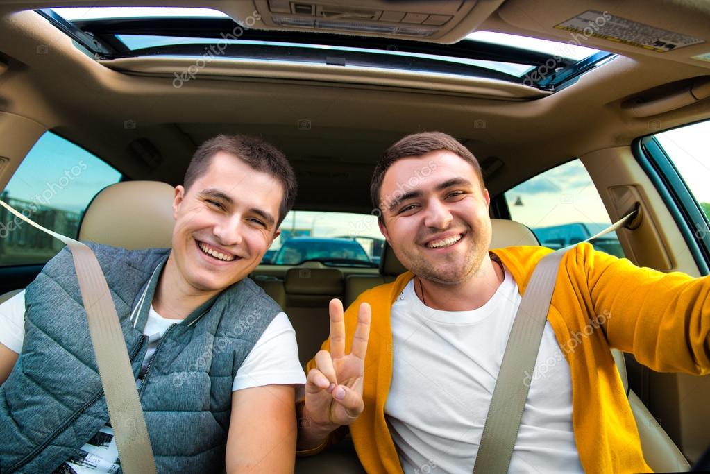 Happy friends ready for vacations driving car Stock Photo by ©JANIFEST ...