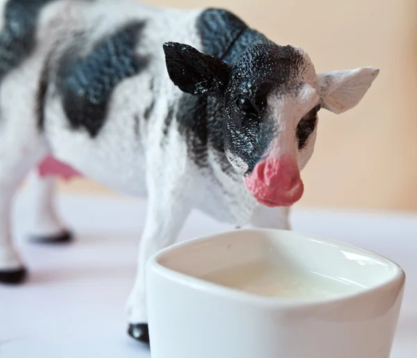 Miniature plastic cow Stock Photo by ©jeancliclac 104729880