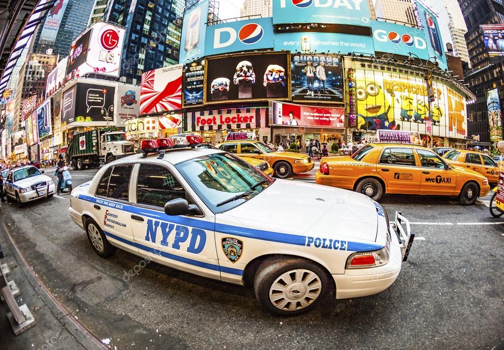 Times square in New York in afternoon light with police car — Stock ...